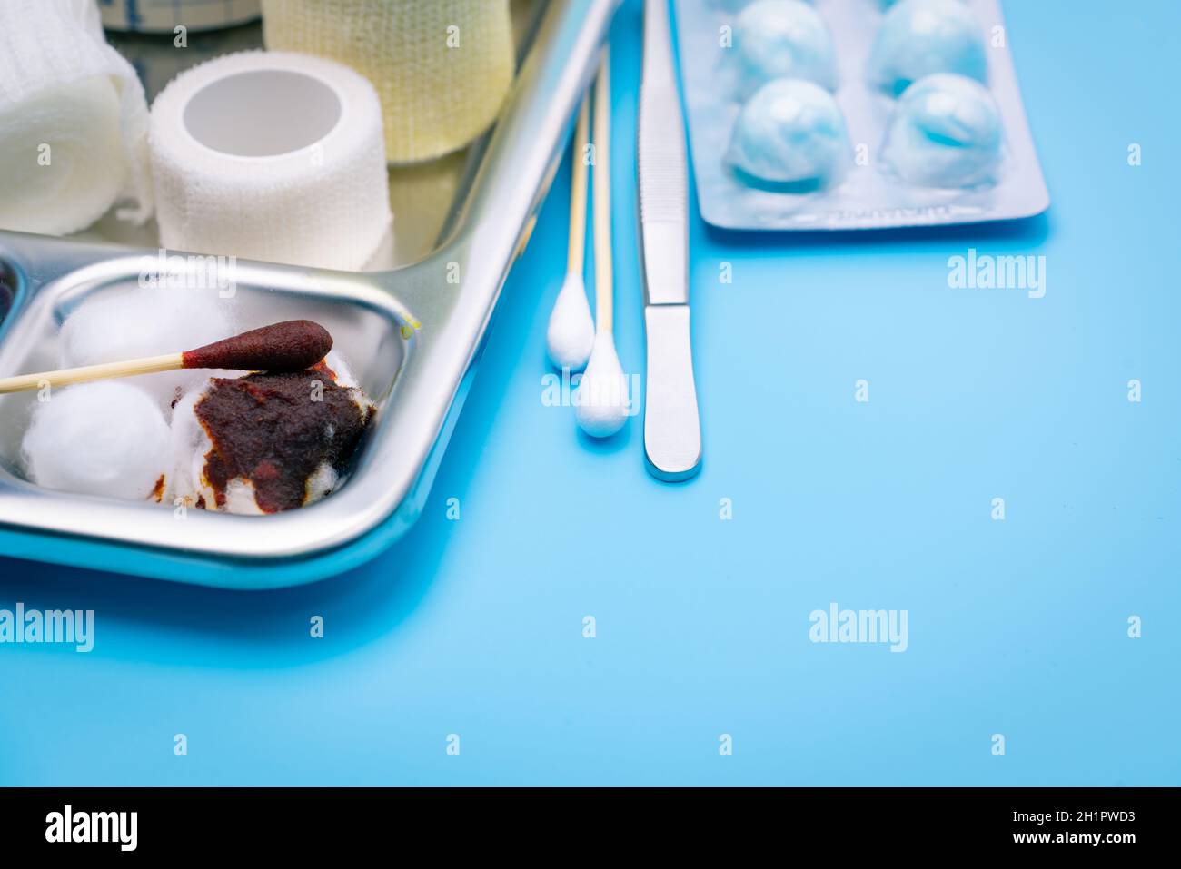 Wound care dressing set and stainless steel plate on blue background ...
