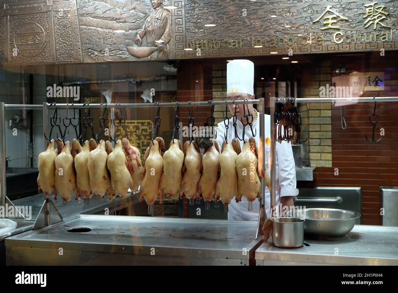 Chefs prepare duck roasting in the original Quanjude restaurant at the ...