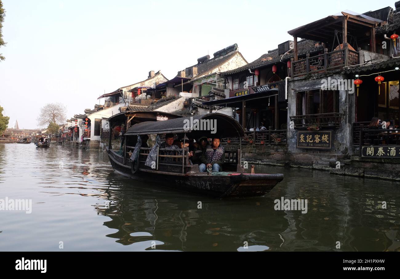 Tourist boats on the water canals of Xitang Town in Zhejiang Province ...