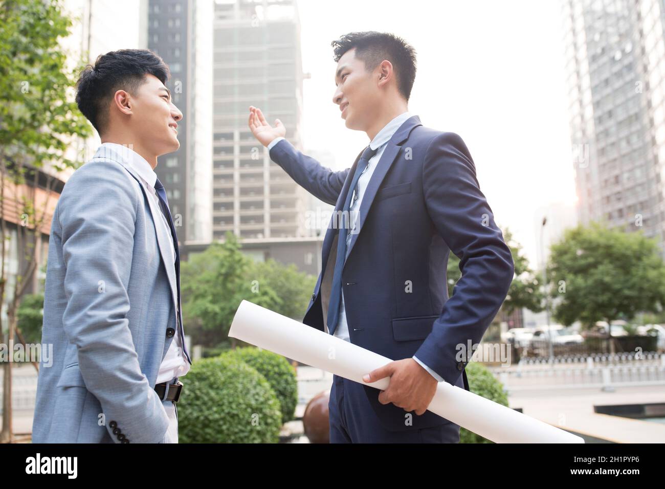 Architects discussing their work Stock Photo - Alamy
