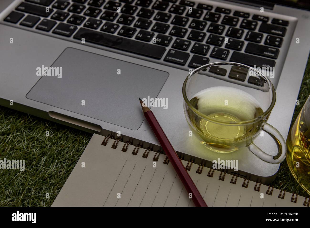 Relaxing time with a cup of tea. Workplace area with laptop, tea cup ...