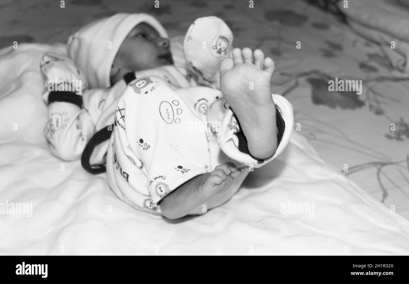 Closeup image of cute beautiful adorable baby boy foot posing on ...