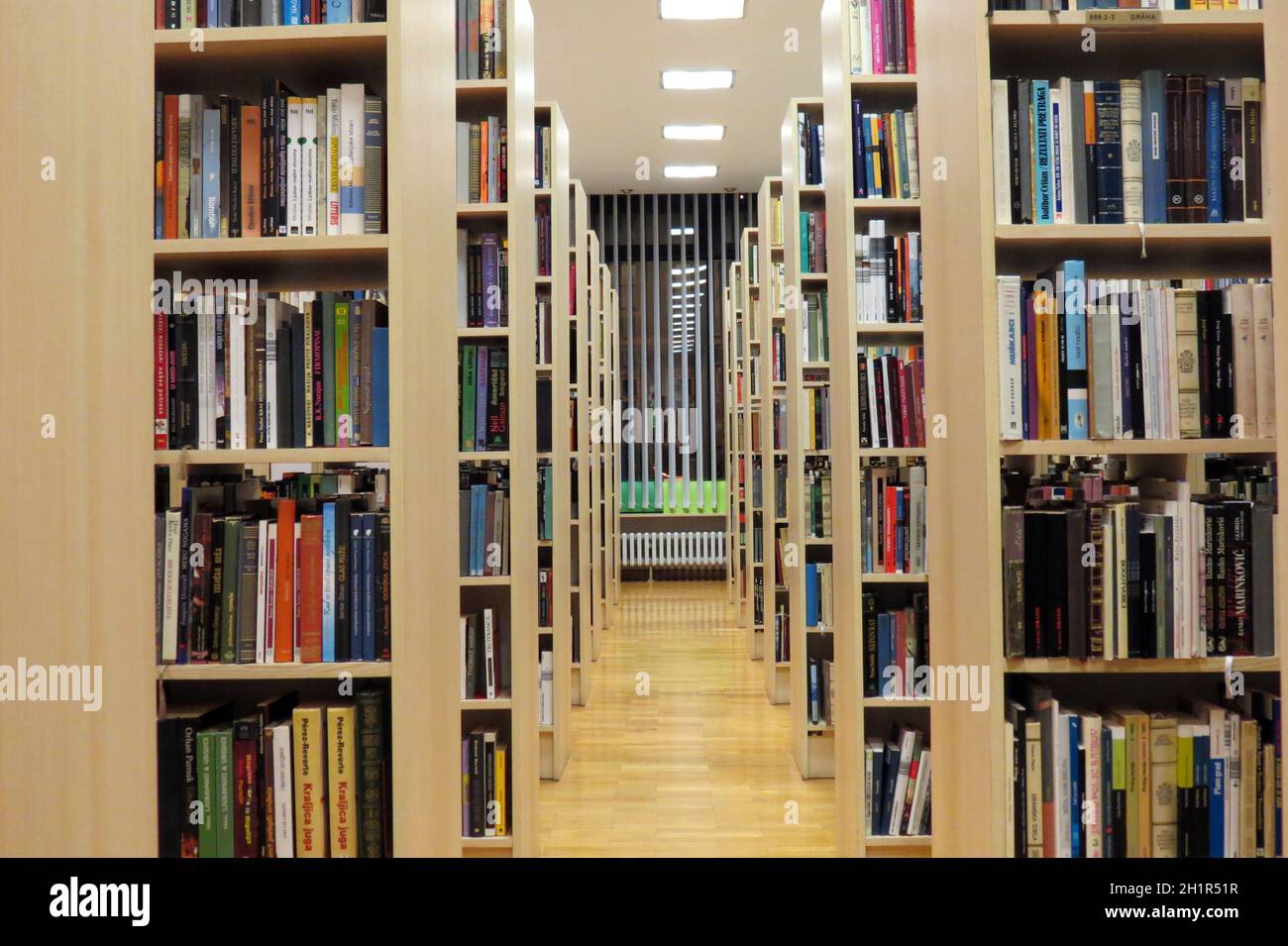 Bookshelf in library Stock Photo - Alamy