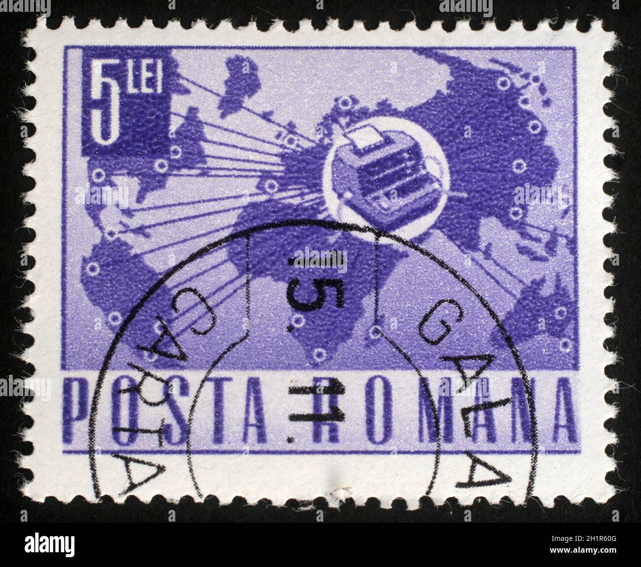 Stamp printed in Romania shows Telex instrument and world map, circa ...