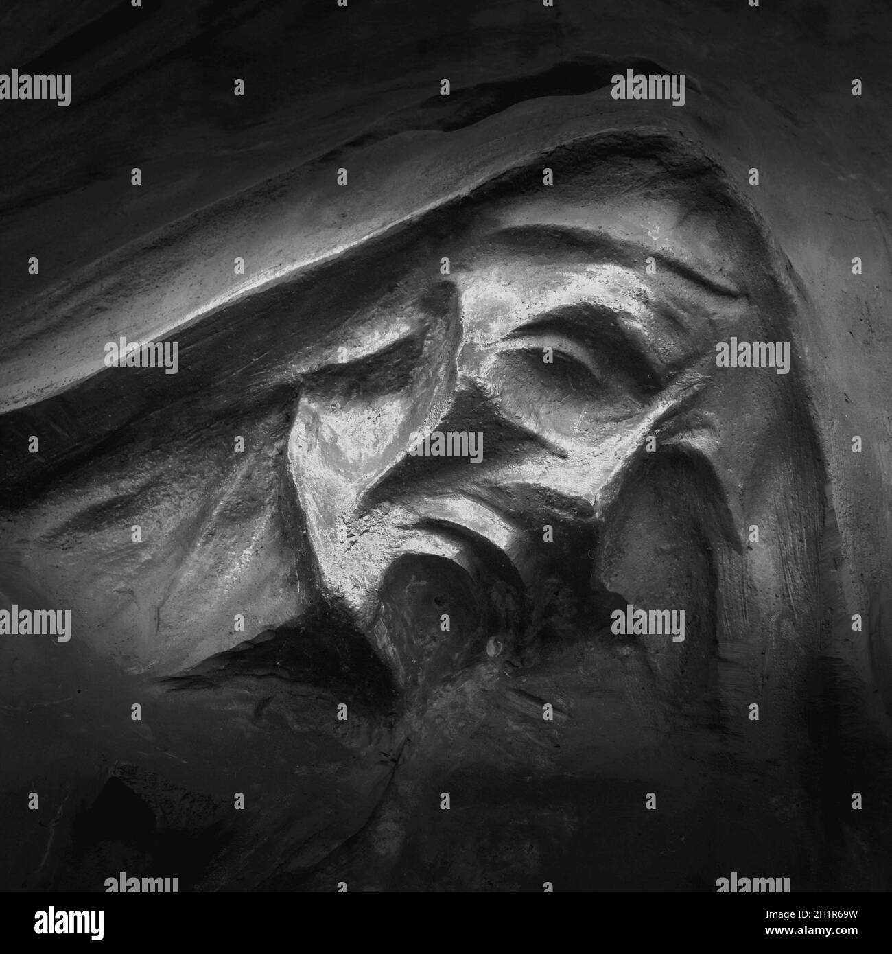 Abstract bas-relief depicting a skeletal face Stock Photo - Alamy