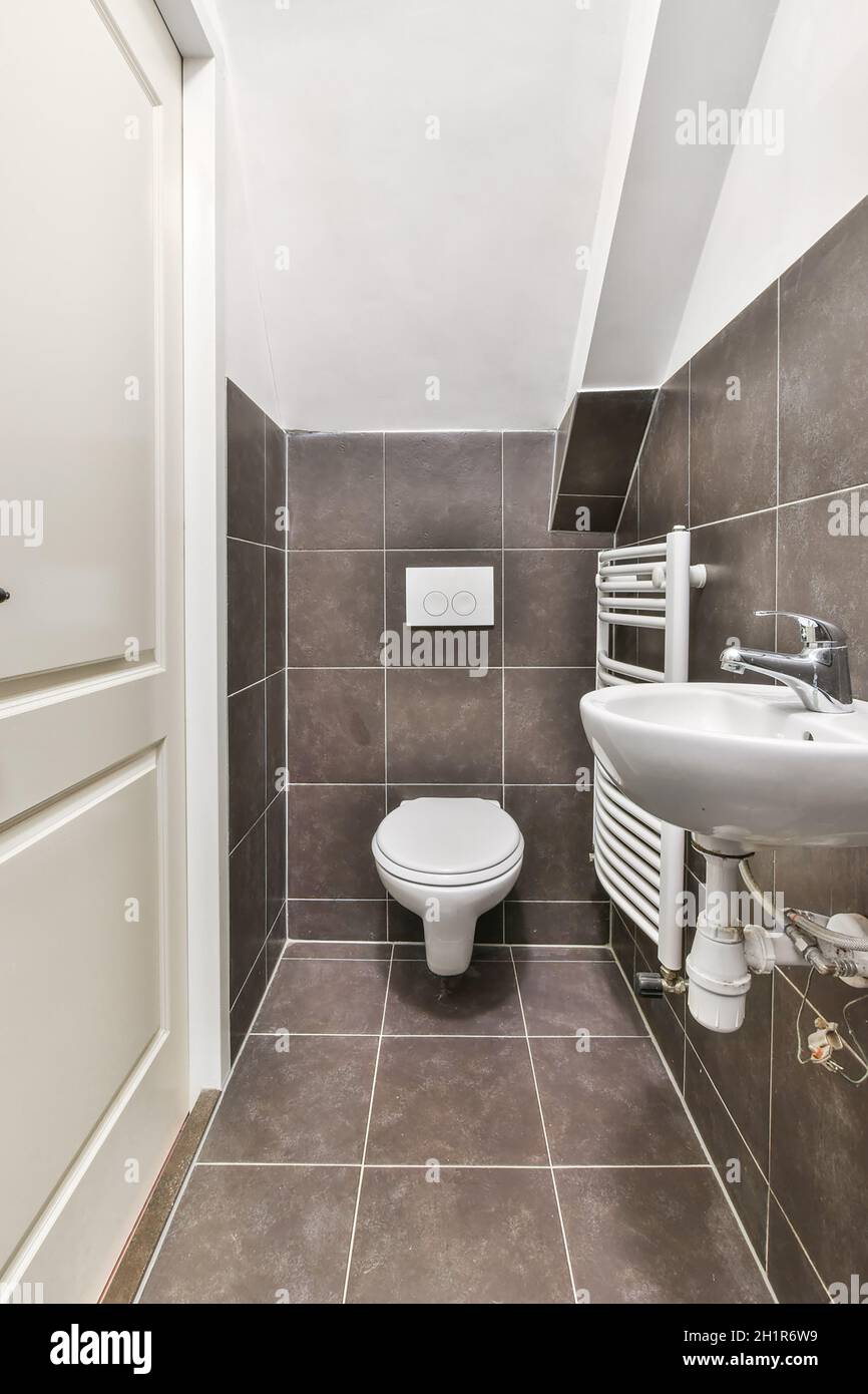 Interior of small clean restroom in miniature style Stock Photo - Alamy