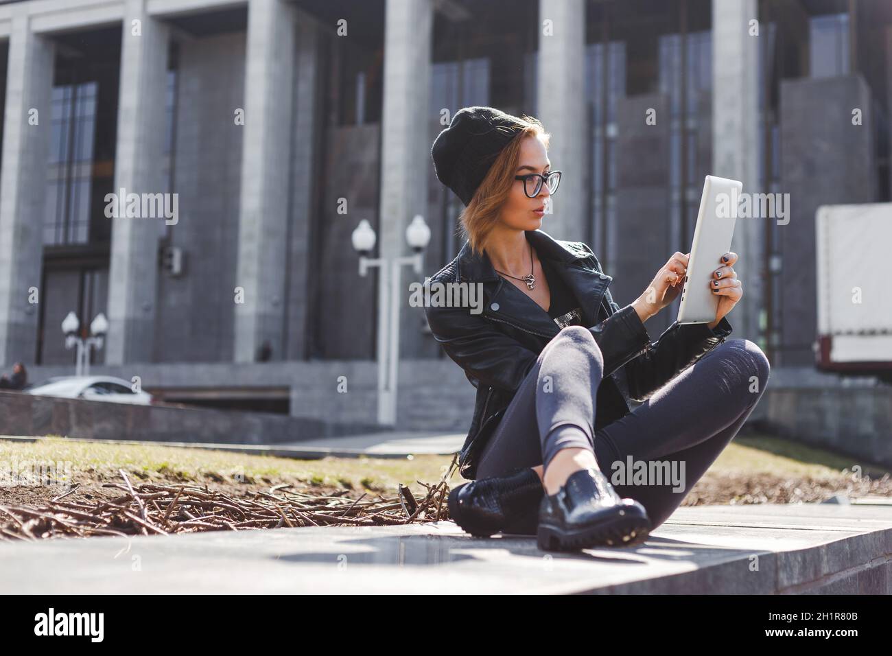 Cute girl hacker programmer working with tablet computer outdoors Stock ...