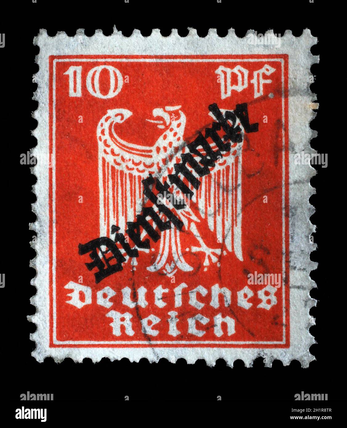 Stamp printed in the German Empire shows coat of arms of Germany, circa ...