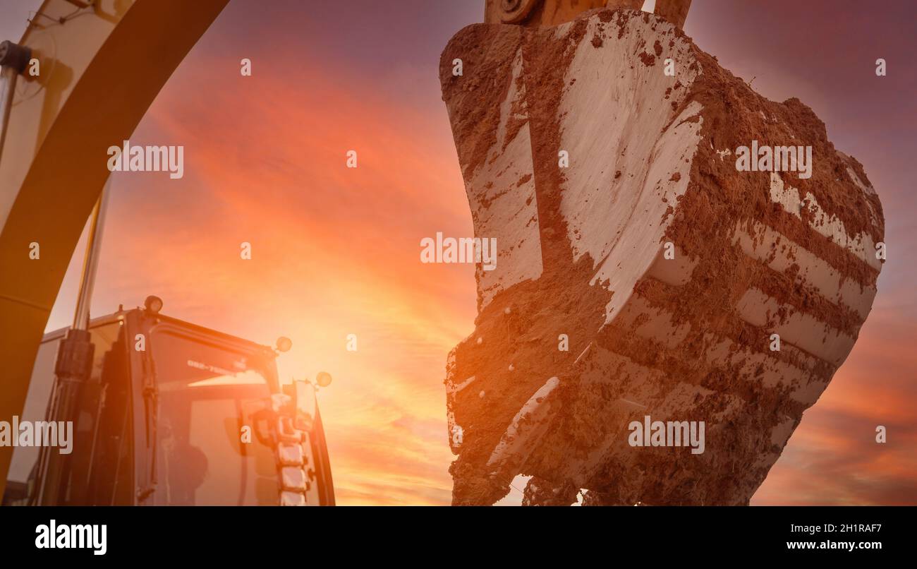 Excavator construction site sunset High Resolution Stock Photography ...