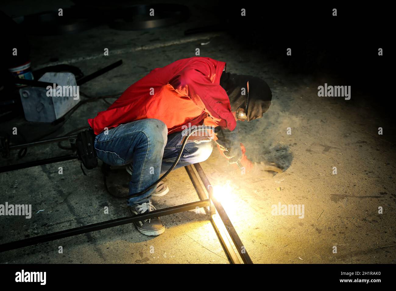 Welder used grinding stone on steel in factory with sparks, Welding ...