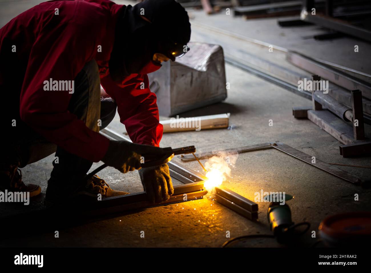 Welder used grinding stone on steel in factory with sparks, Welding ...