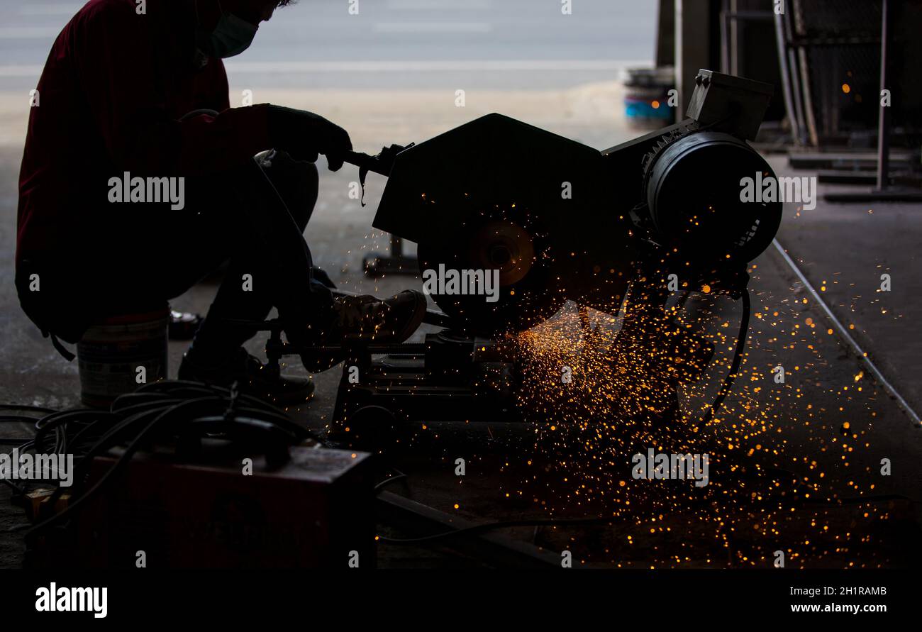 Welder used grinding stone on steel in factory with sparks, Welding ...