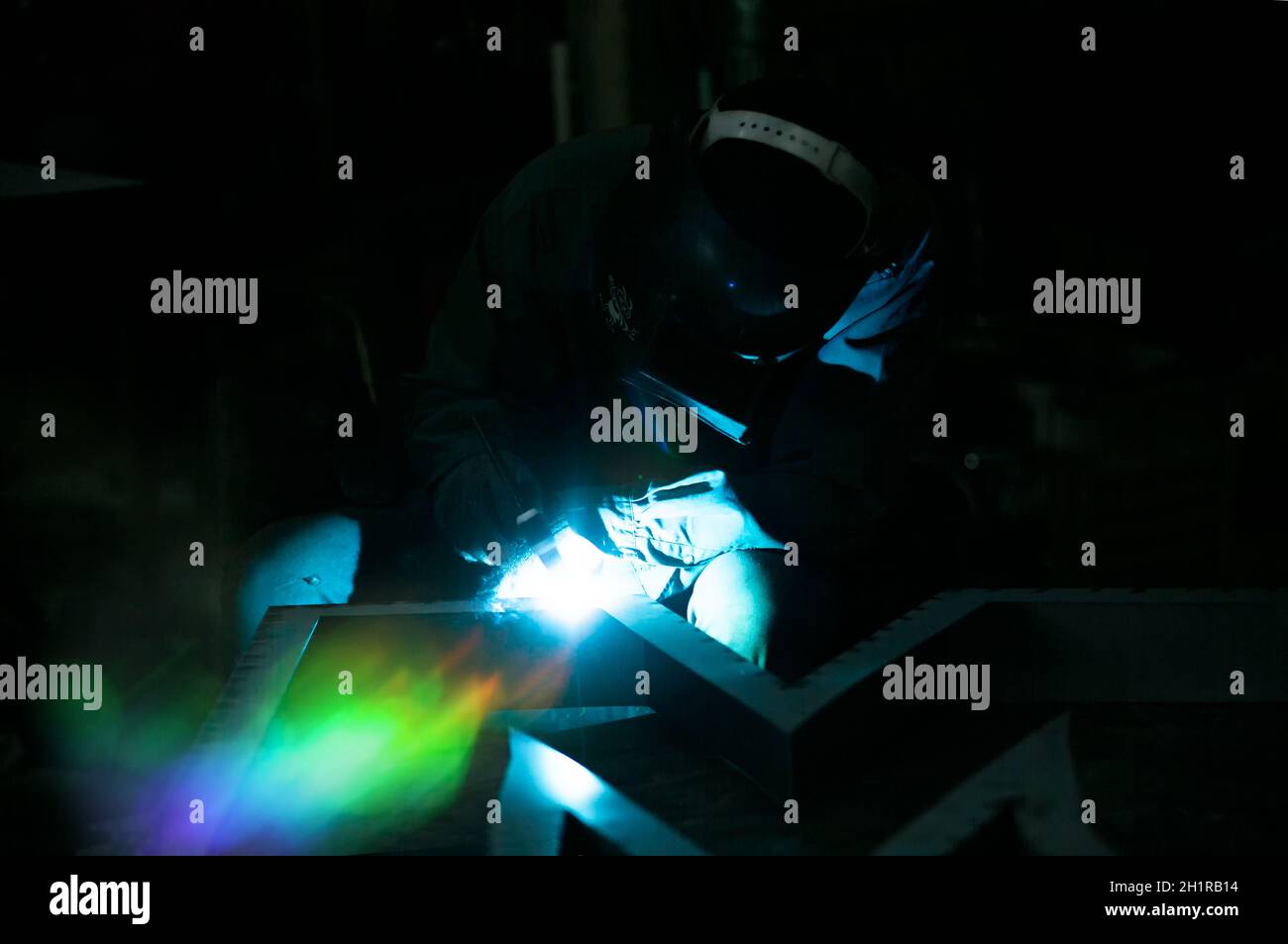 Welder used grinding stone on steel in factory with sparks, Welding ...