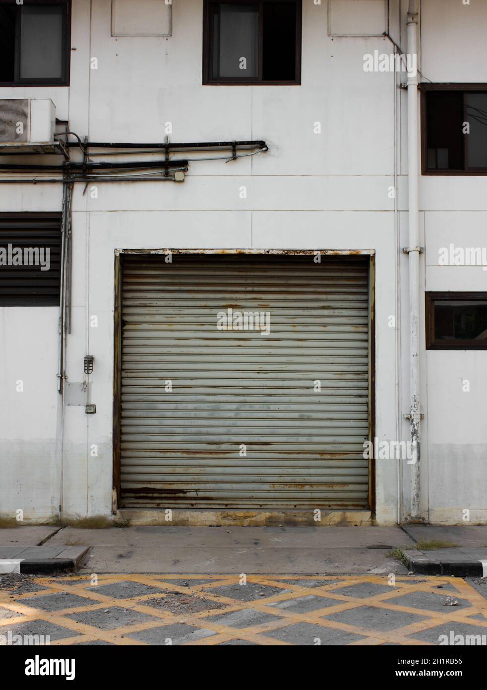 Shutter door still inside the factory security Stock Photo - Alamy
