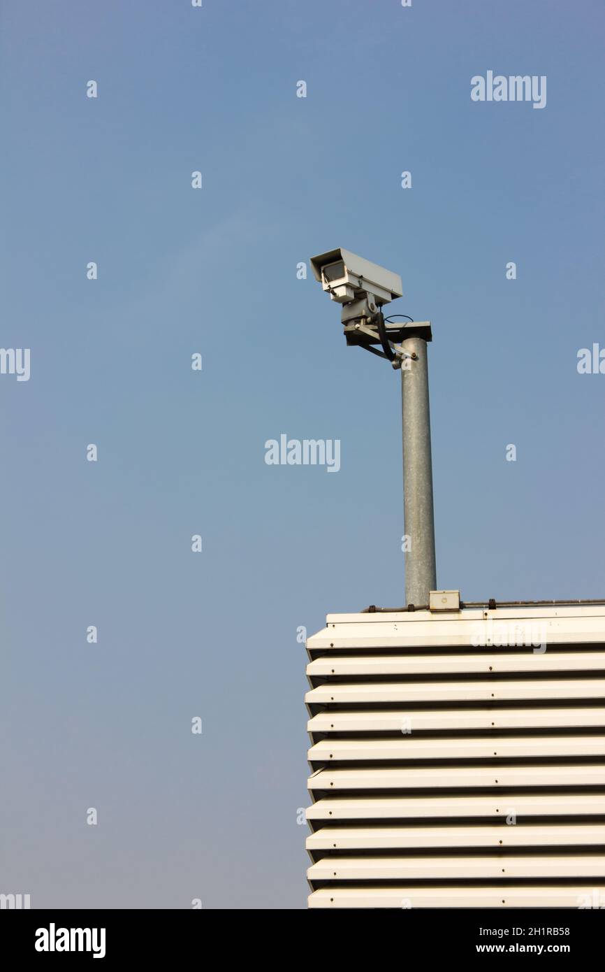 Security camera record on blue sky background Stock Photo - Alamy