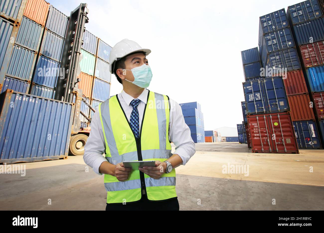 Container port, foreman and insurance claim officer checking on ...