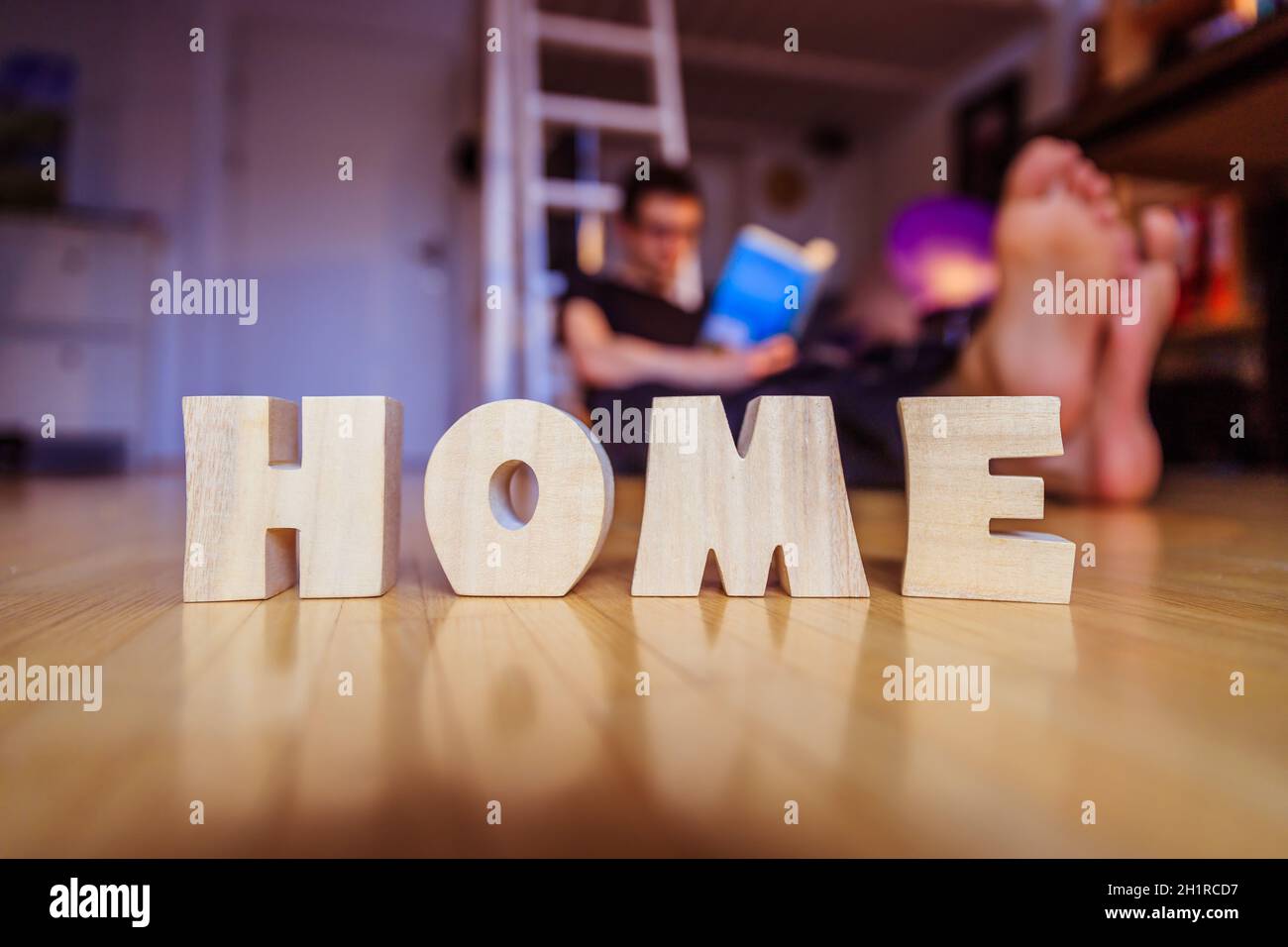 Wooden HOME Letters on the floor of an apartment Stock Photo - Alamy