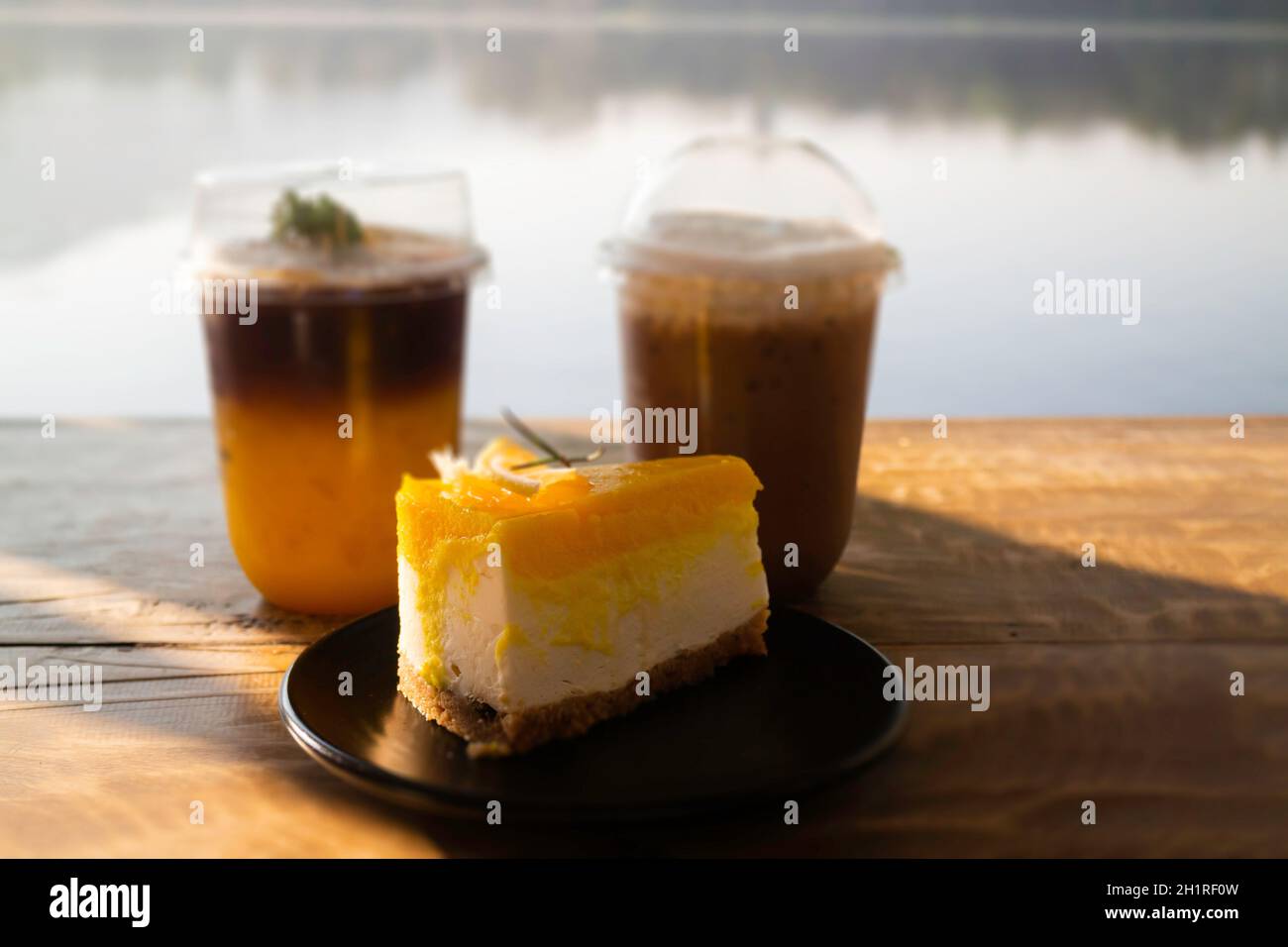 Coffee and sweet in the morning sunshine, stock photo Stock Photo - Alamy