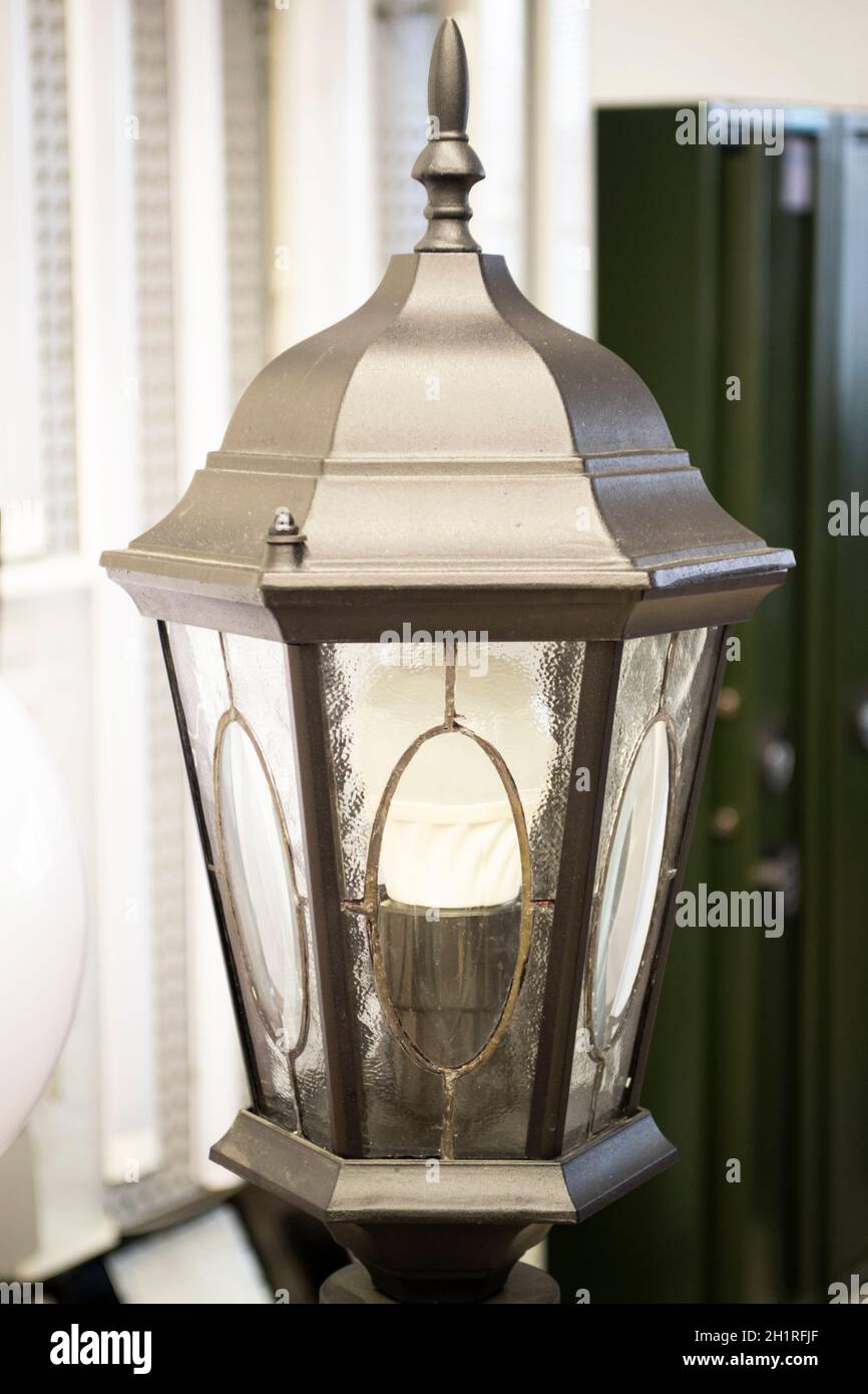 Classic metal black street lamp post with LED lightning close up Stock ...