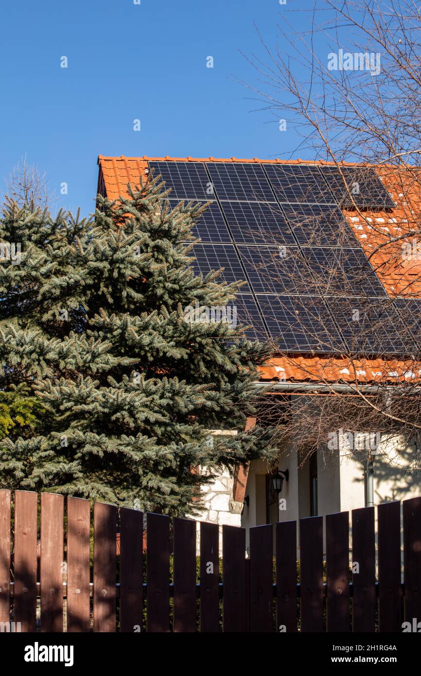Solar electric panels on a house roof Stock Photo - Alamy