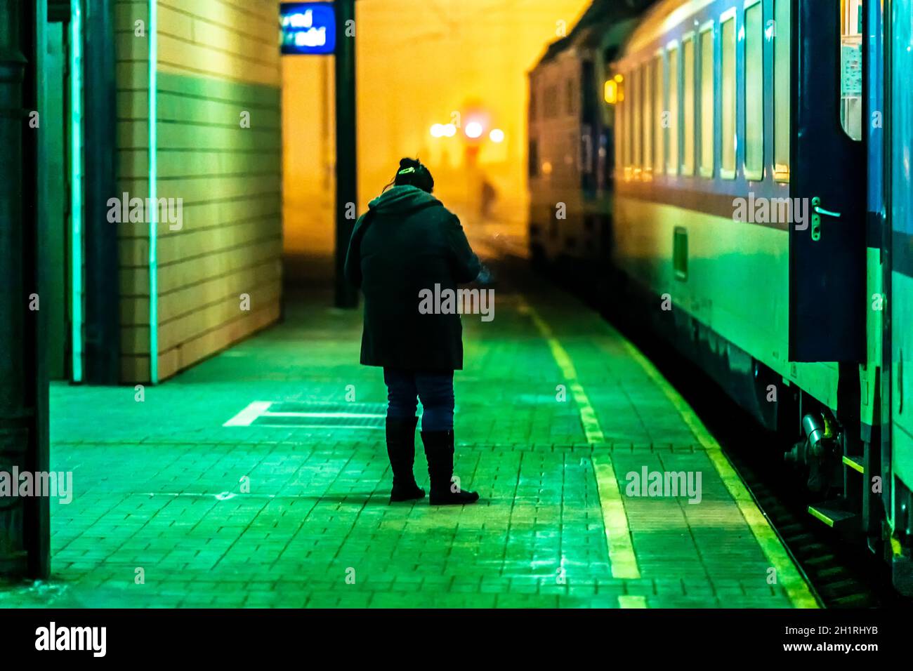 woman boarding a night train at the station Stock Photo - Alamy
