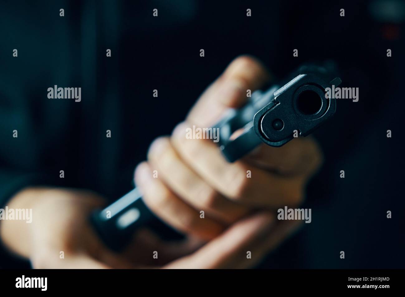 Muzzle of gun close-up. Man reloading pistol. Weapon ammunition ...