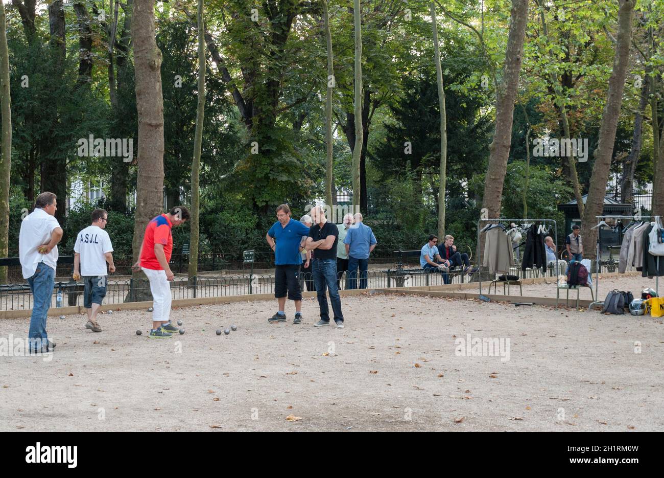 Playing petanque in the late afternoon in Luxemburg Garden in Paris ...