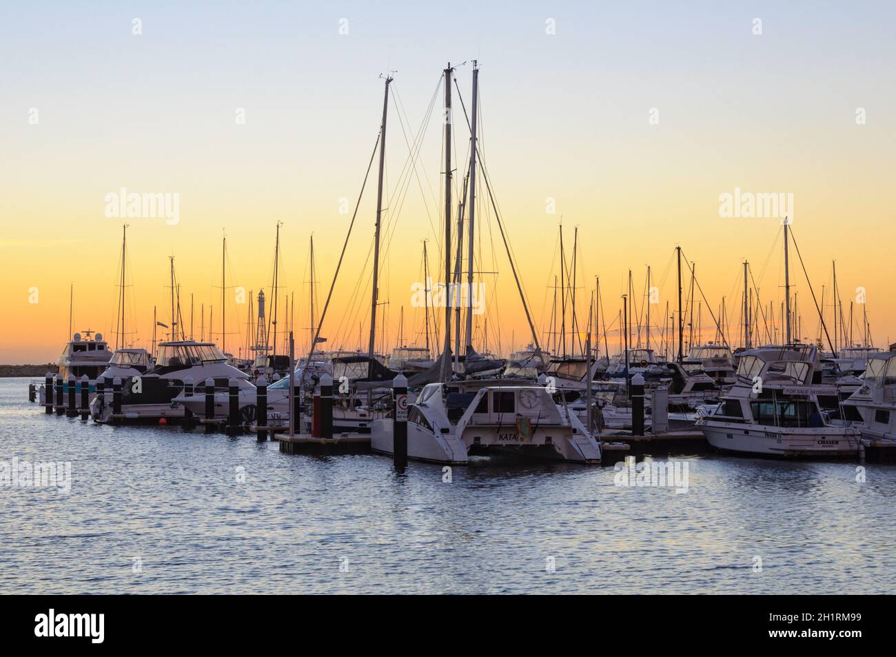 Sunset over the Hillarys marina full of mooring boats - Perth, WA ...