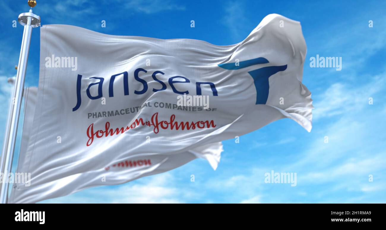 Beerse, Belgium, March 12 2021: Janssen flags flying in the wind ...