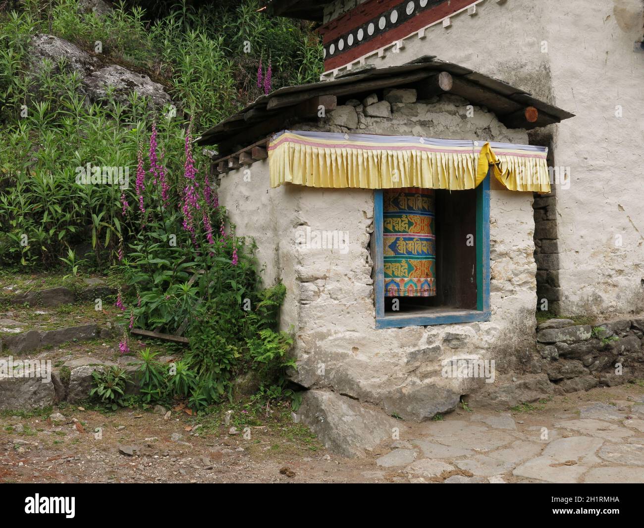 Sheltered prayer wheel in the Everest Region Stock Photo - Alamy