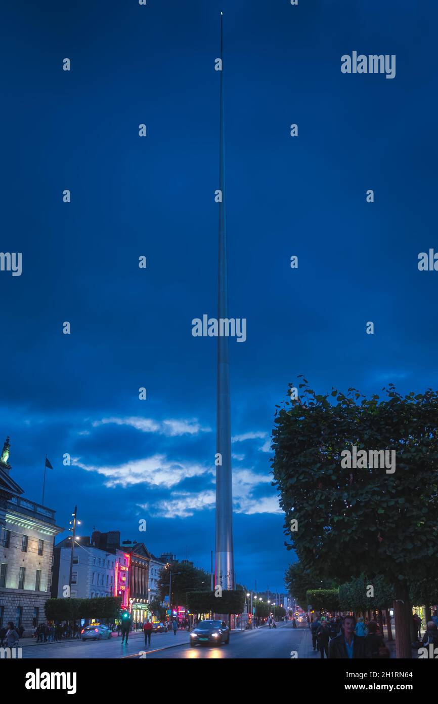Dublin, Ireland, August 2019 Dublin Spire at night with blurred people ...