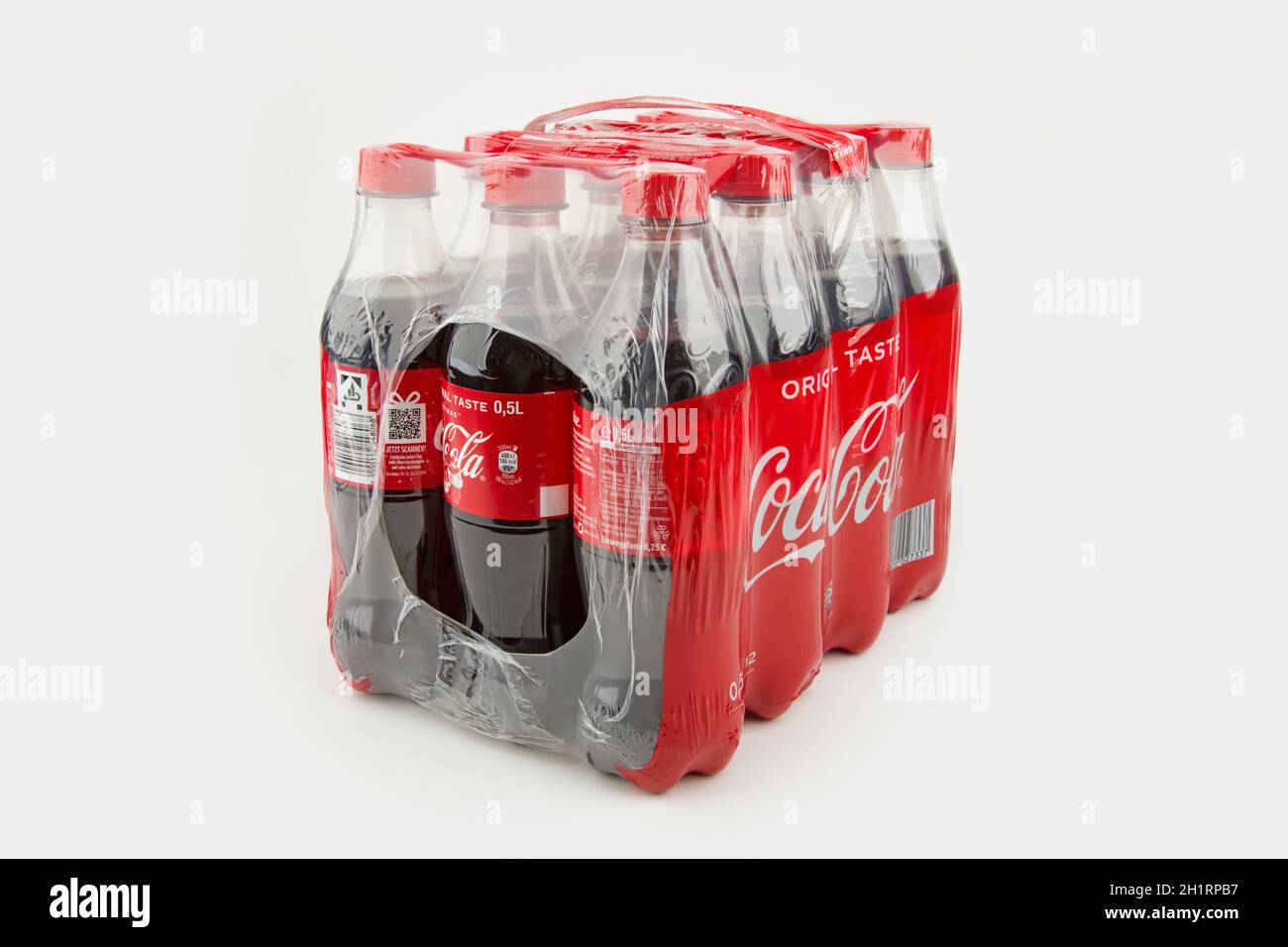 HUETTENBERB, GERMANY 2020-12-17: Wrapped Coca Cola Bottles on white ...