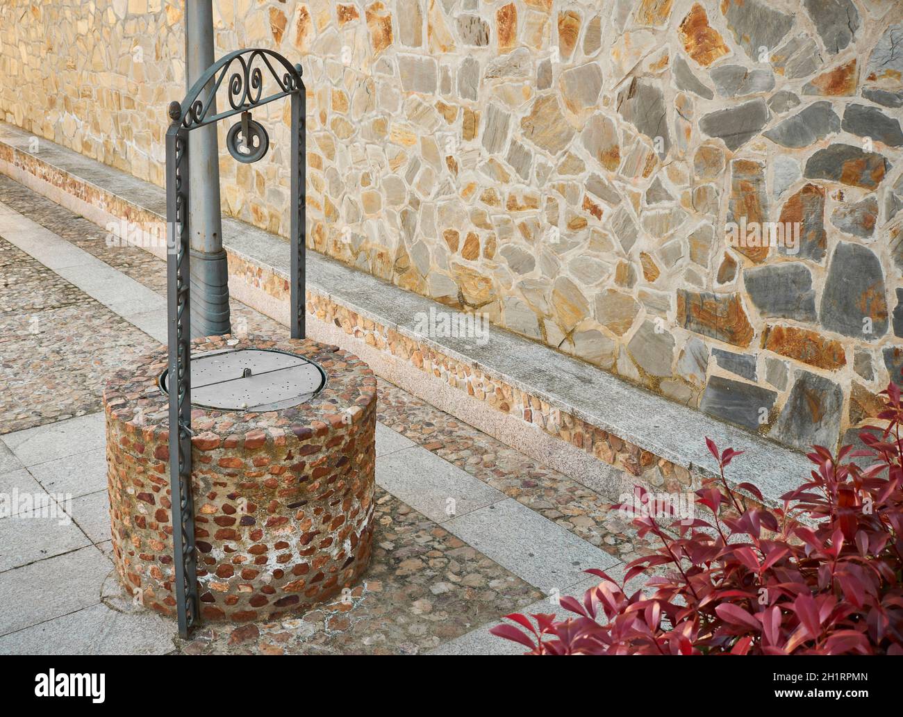 Well to extract underground water made of stone and traditional style ...