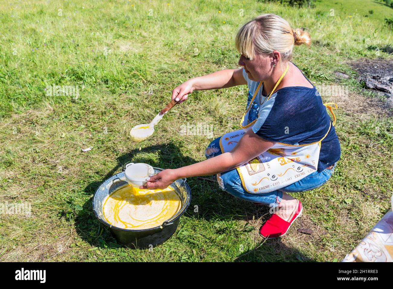 Yasinia, Ukraine - June 27, 2017: Unidentified Woman puts on a plate ...