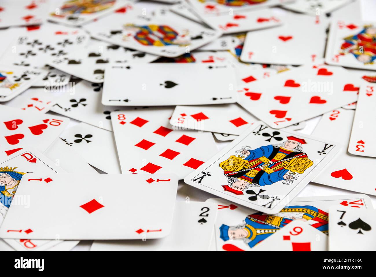 Classic playing card game laid out on a table. White background Stock ...