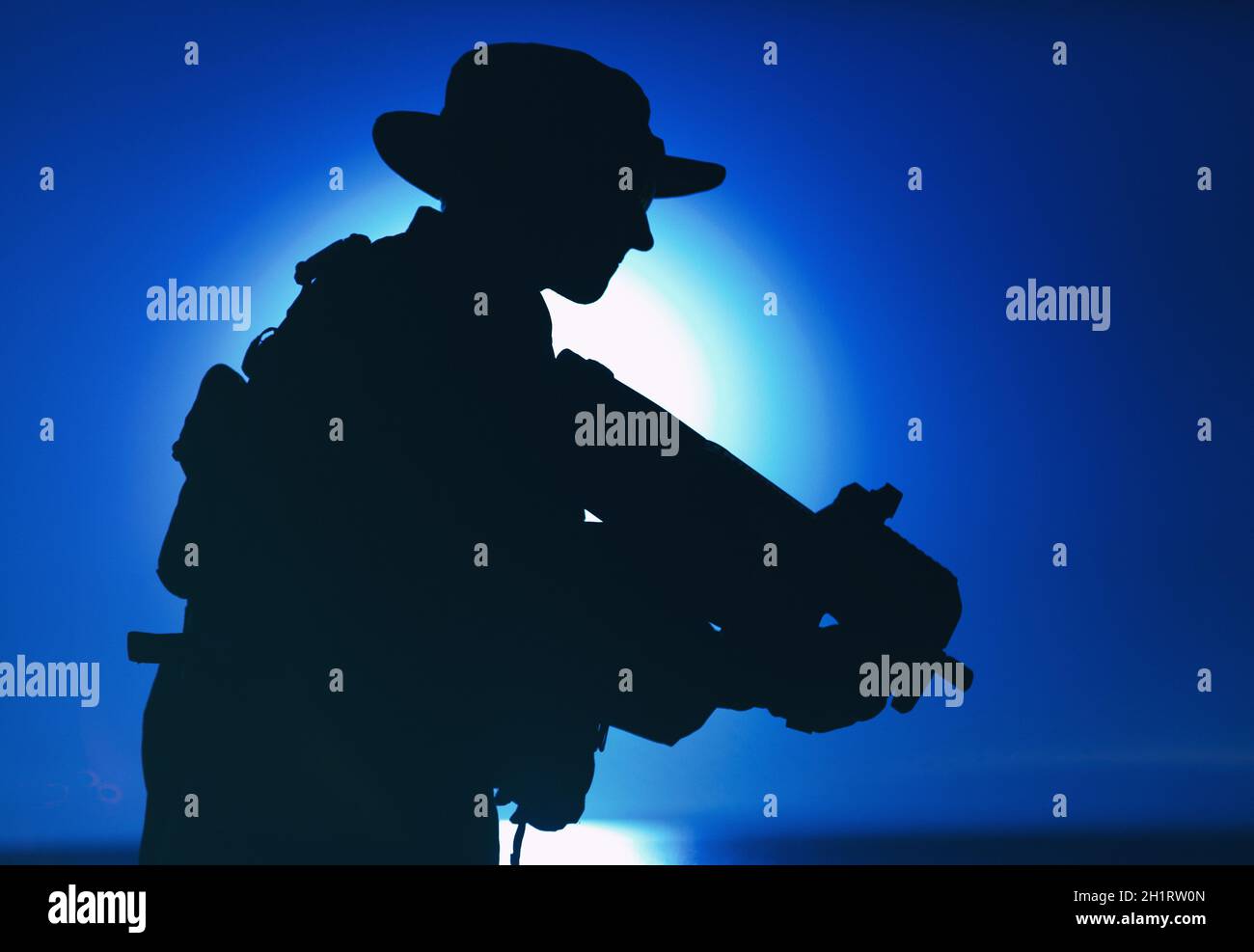 Silhouette of army special forces commando, soldier in boonie hat ...