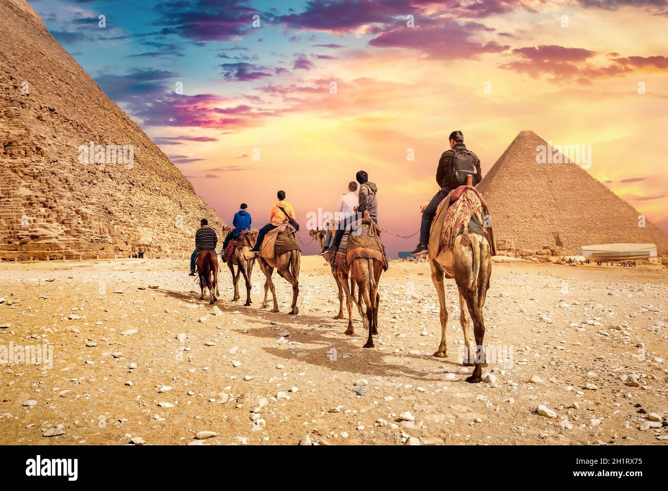Egyptian pyramids in the desert at sunset Stock Photo - Alamy