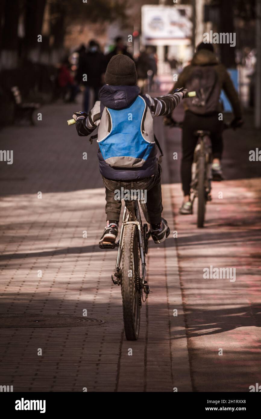 Boy doing a wheelie on bicycle hi-res stock photography and images - Alamy