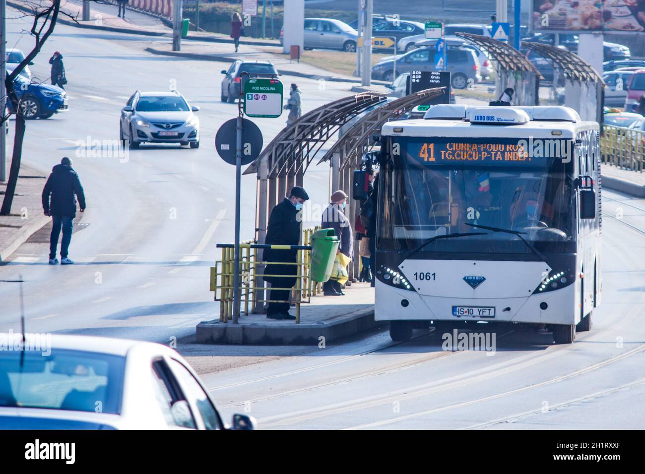 Iasi - Romania - 13th March 2021: Bus station with people waiting and ...
