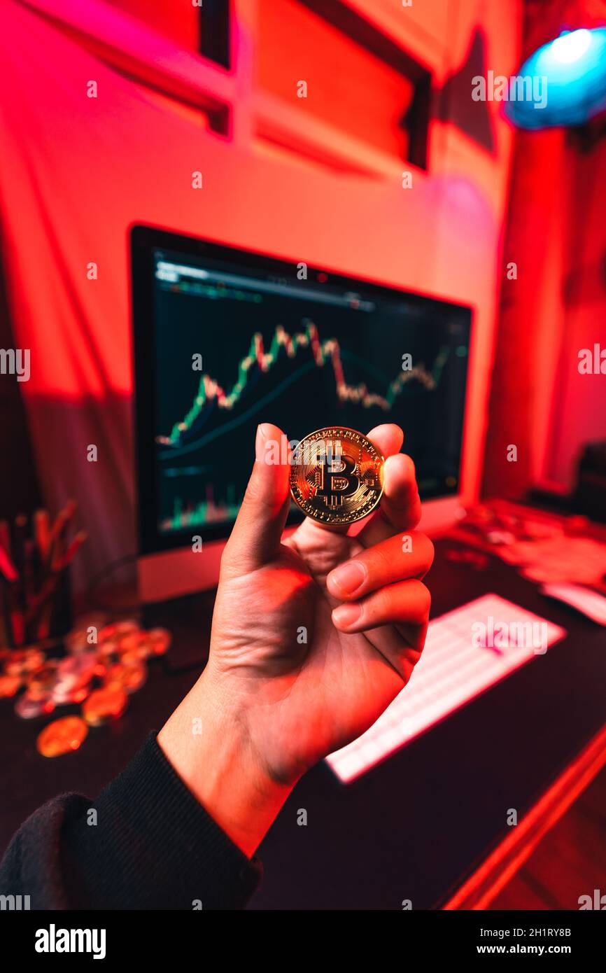 Bitcoin on a home computer chart and money and investment Stock Photo ...