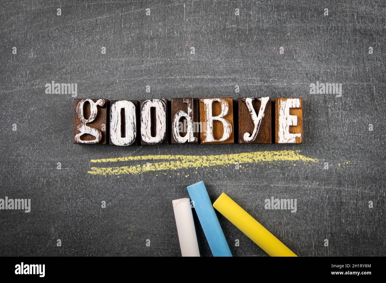 Goodbye. Communication concept. Colored pieces of chalk on a blackboard ...