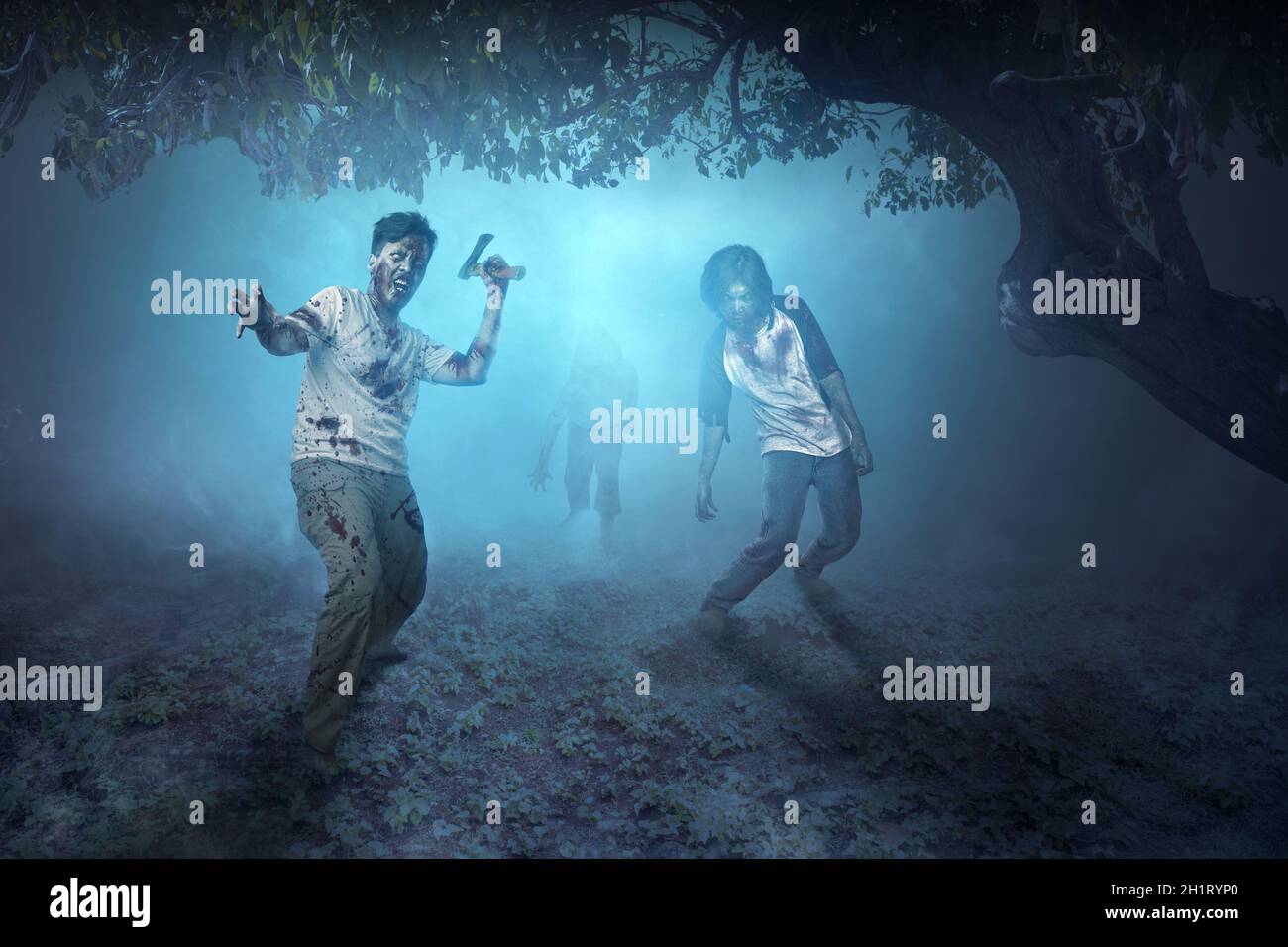 Scary zombies with blood and wound on his body walking on the field ...