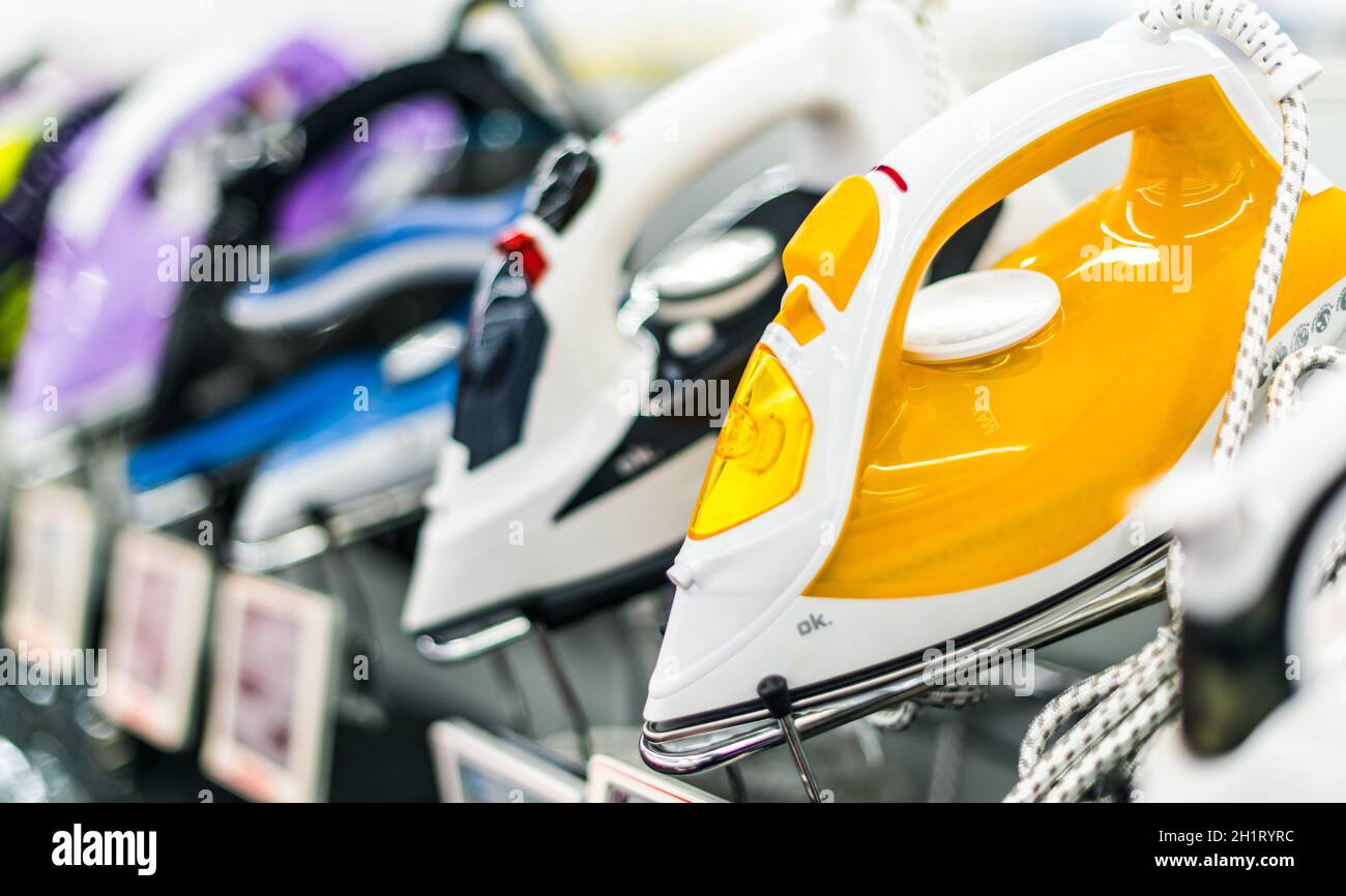 POZNAN, POL - FEB 24, 2021: Different brands of electric steam irons ...