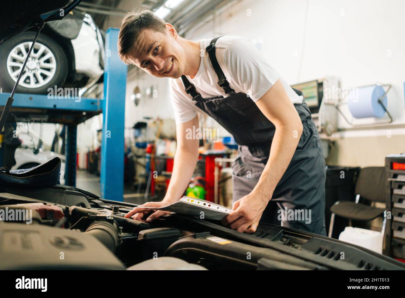 Portrait of smiling professional handsome professional male car ...