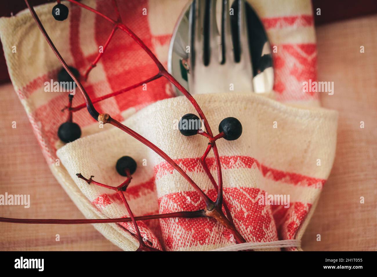 Tableware on kitchen table with autumn decor close up Stock Photo - Alamy