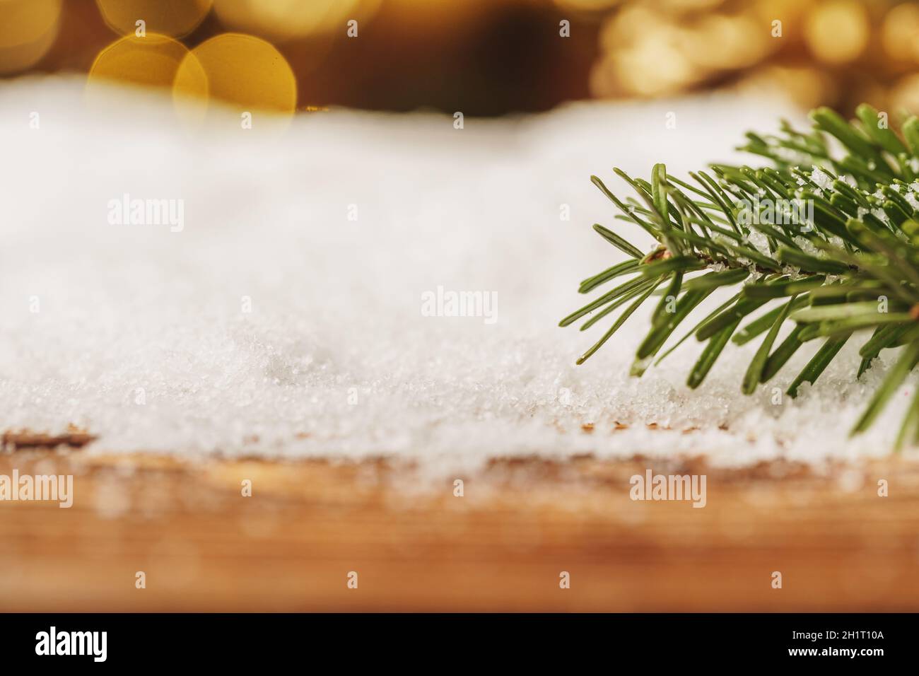 Wooden table with snow on it close up Stock Photo - Alamy