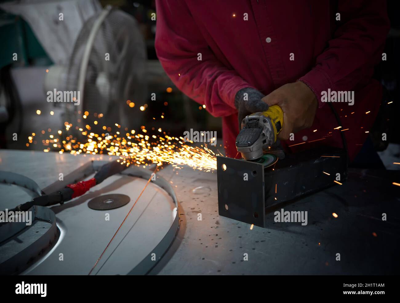 Welder used grinding stone on steel in factory with sparks, Welding ...