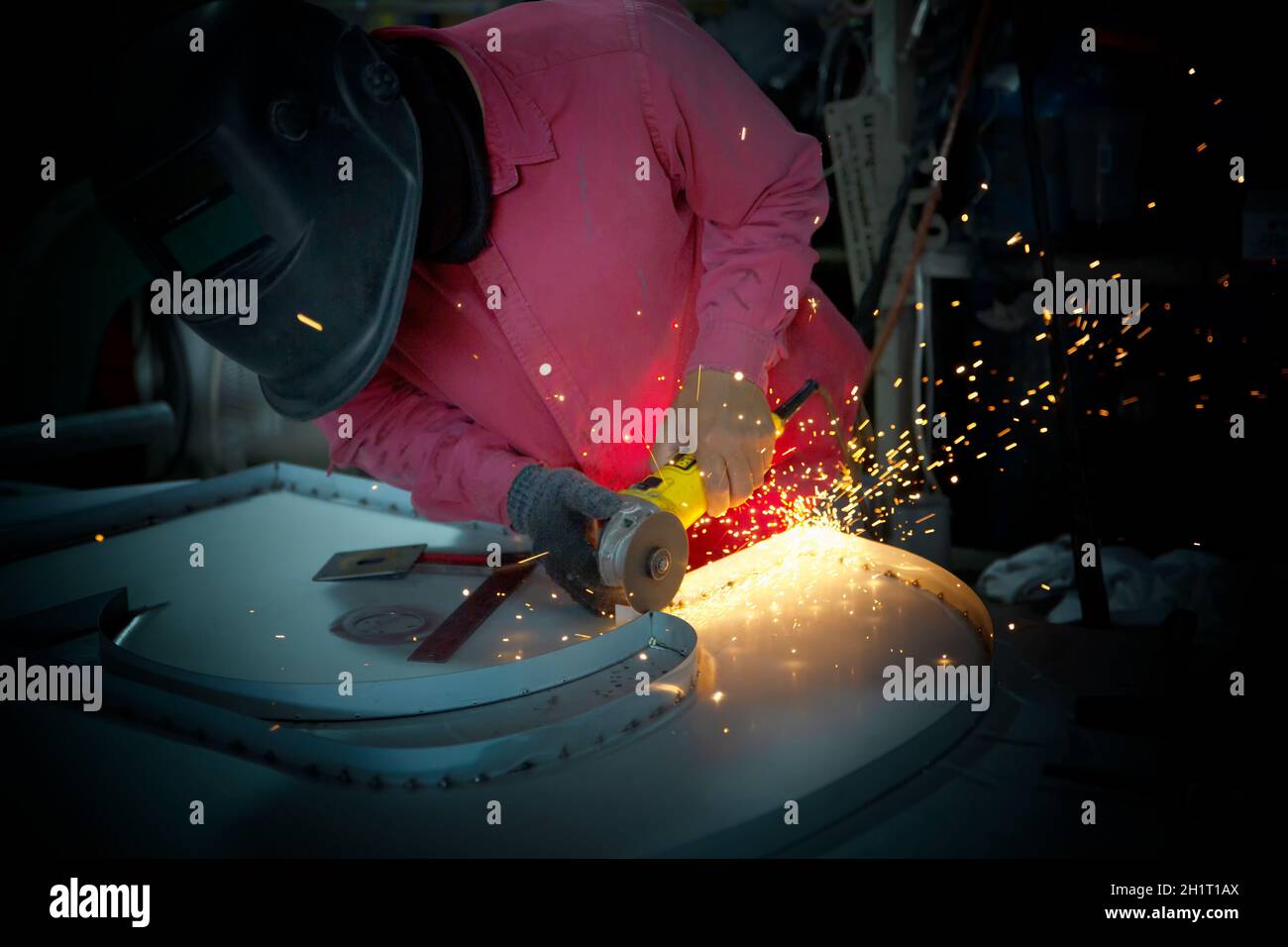 Welder used grinding stone on steel in factory with sparks, Welding ...