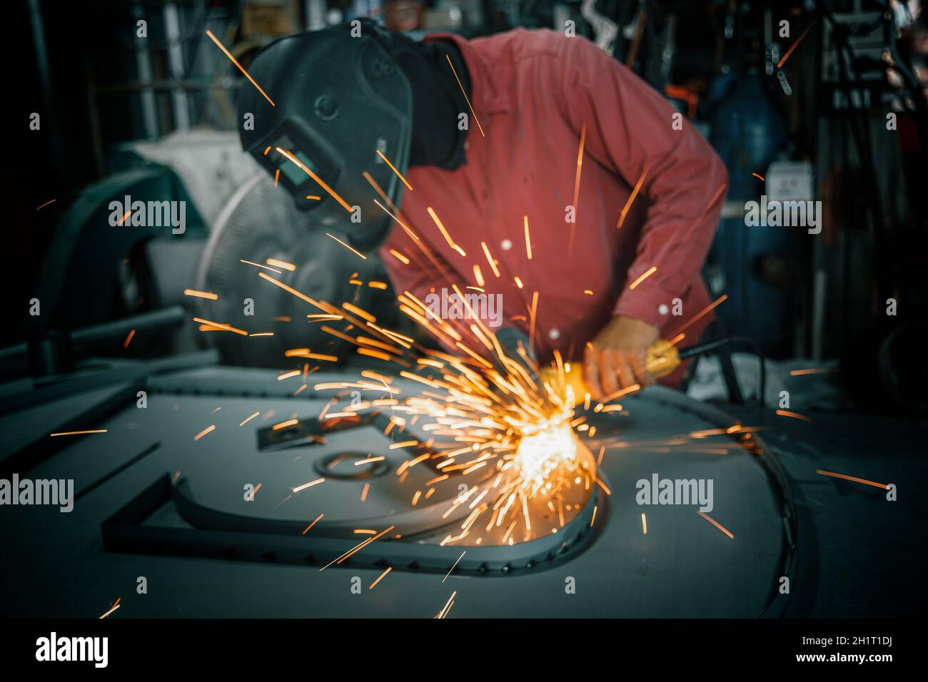 Welder used grinding stone on steel in factory with sparks, Welding ...