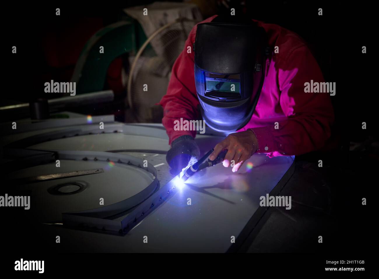 Welder used grinding stone on steel in factory with sparks, Welding ...